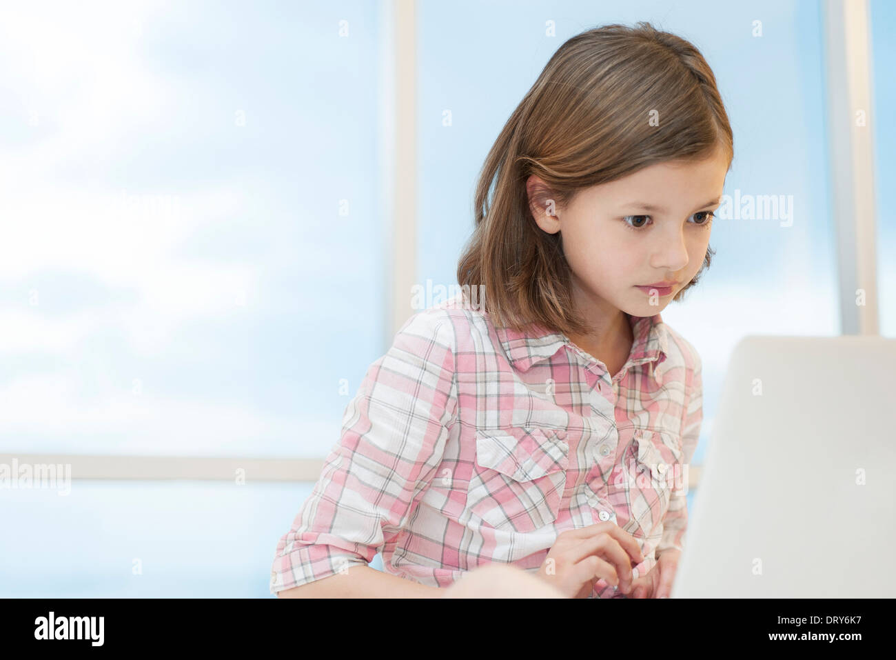 Girl using laptop computer Stock Photo - Alamy