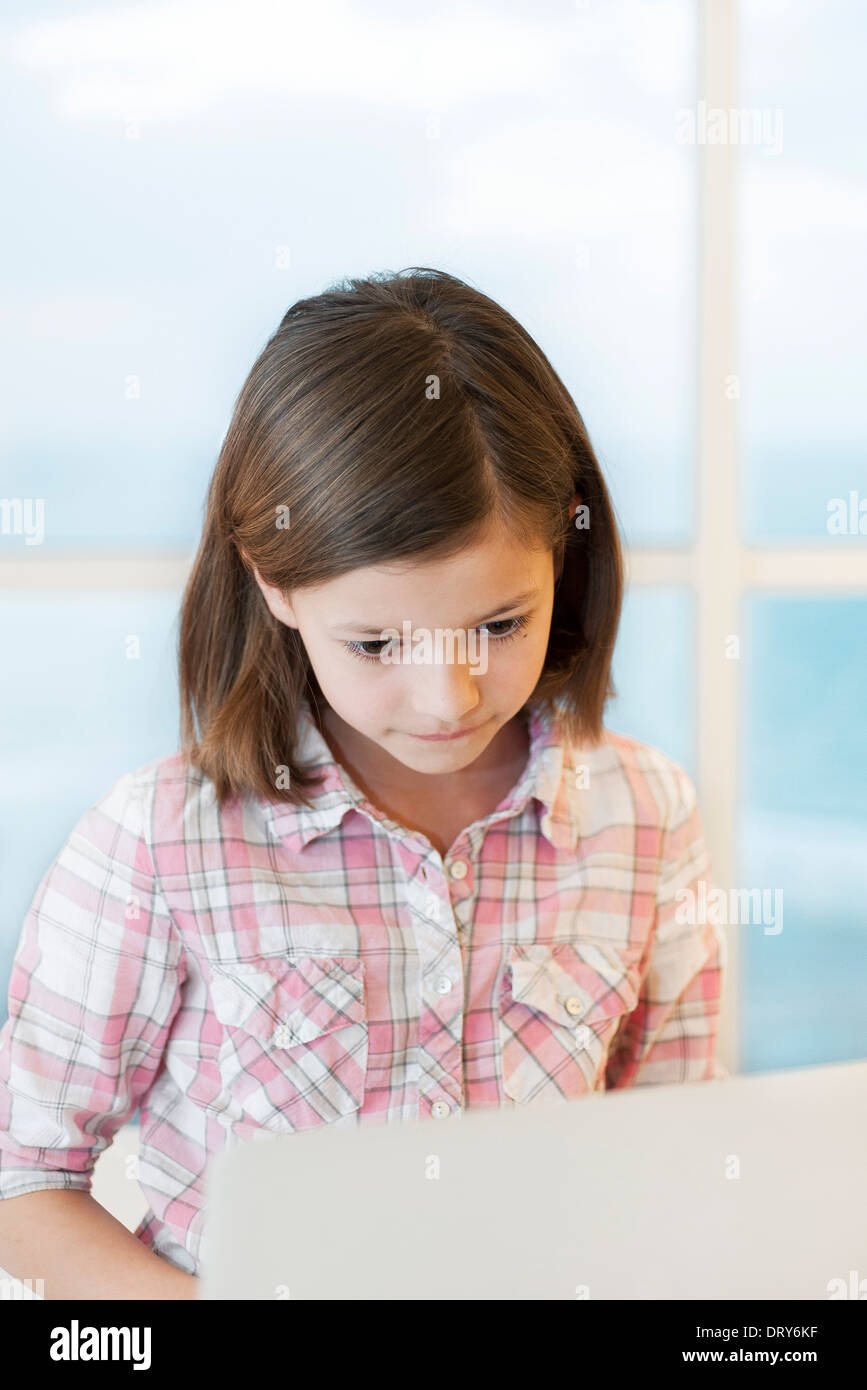 Girl using laptop computer Stock Photo - Alamy