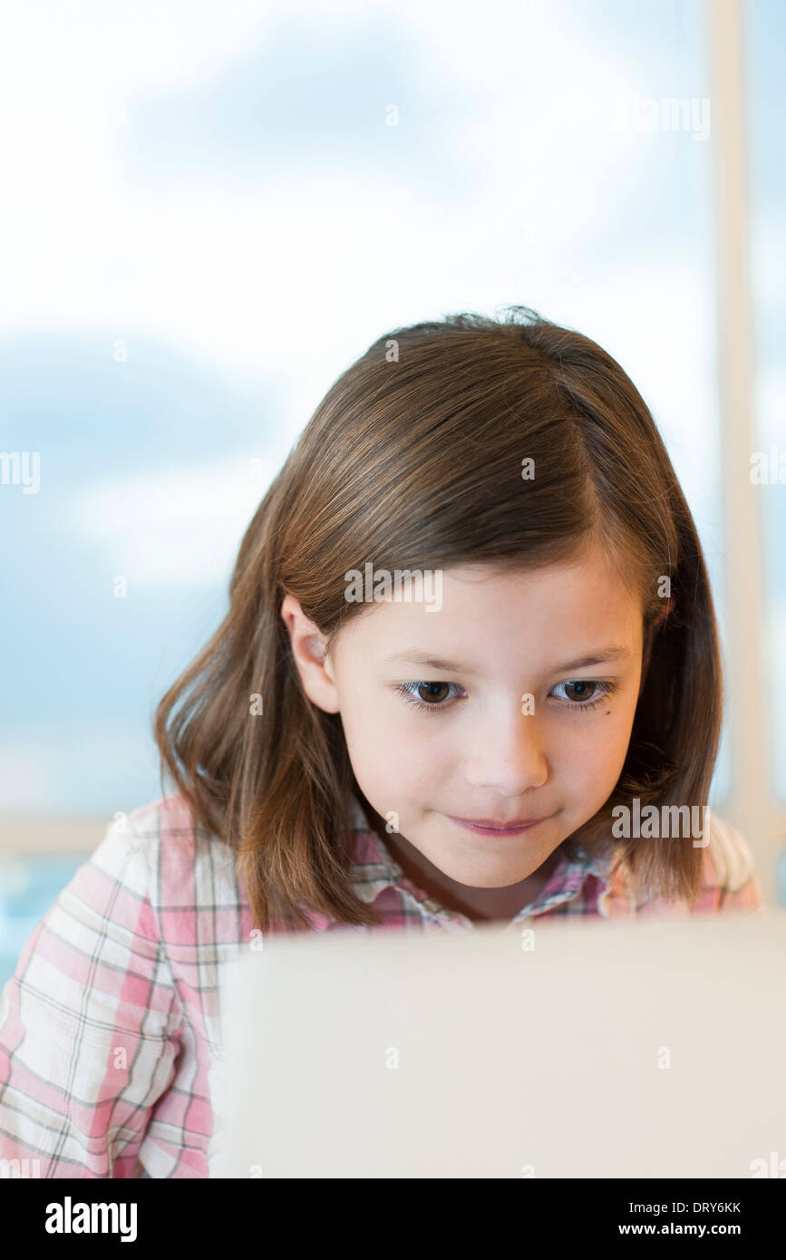 Girl using laptop computer Stock Photo - Alamy