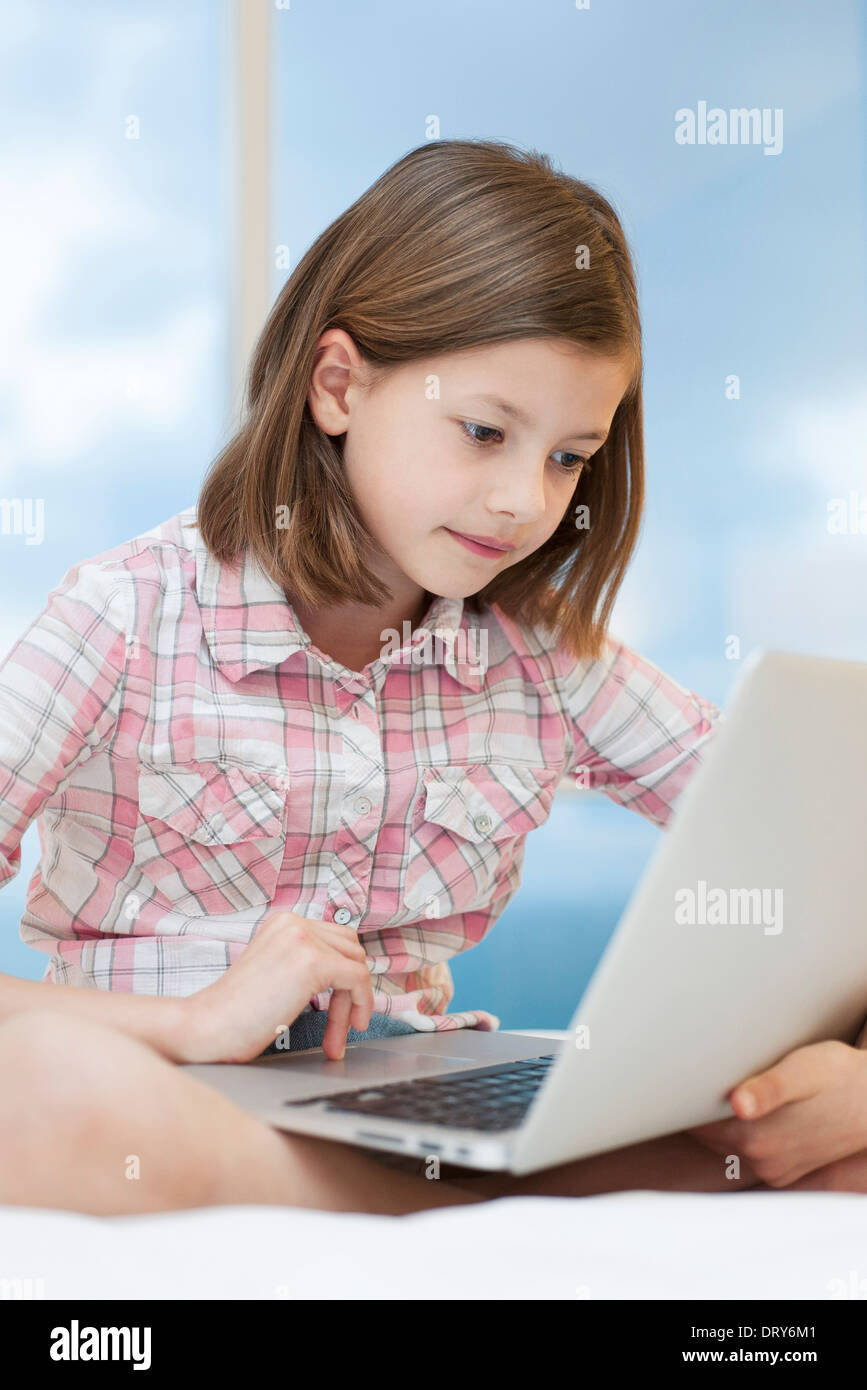 Girl using laptop computer Stock Photo - Alamy