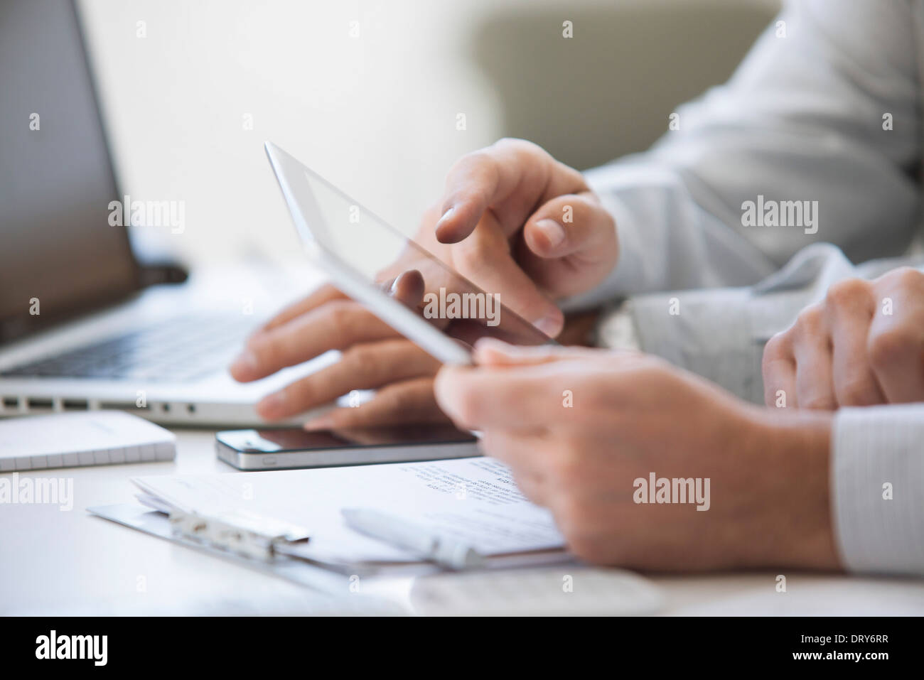 Two men using tablet on desk hi-res stock photography and images - Alamy