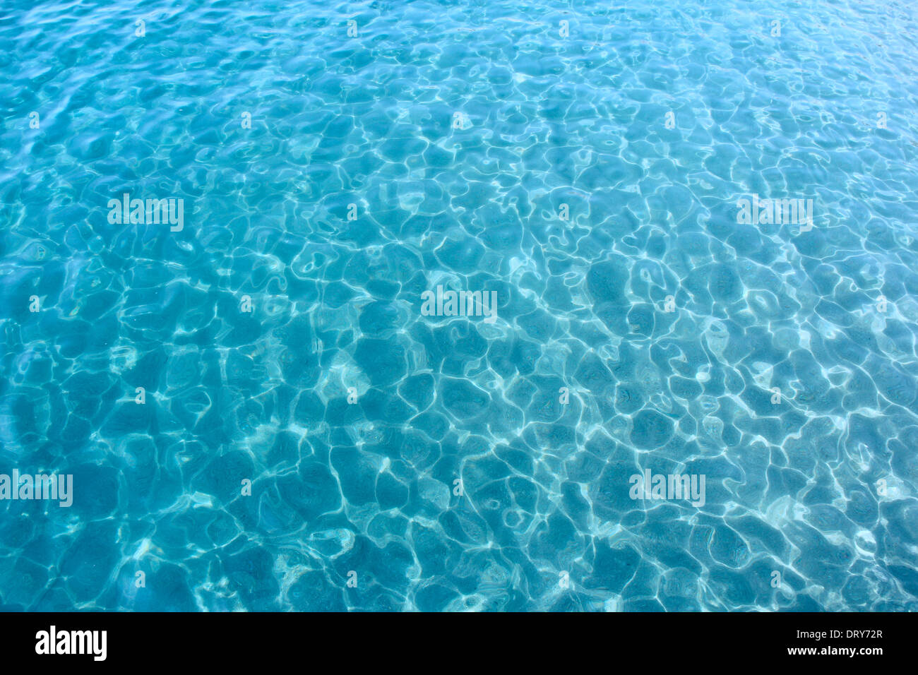 Background of transparent blue sea water top view Stock Photo - Alamy