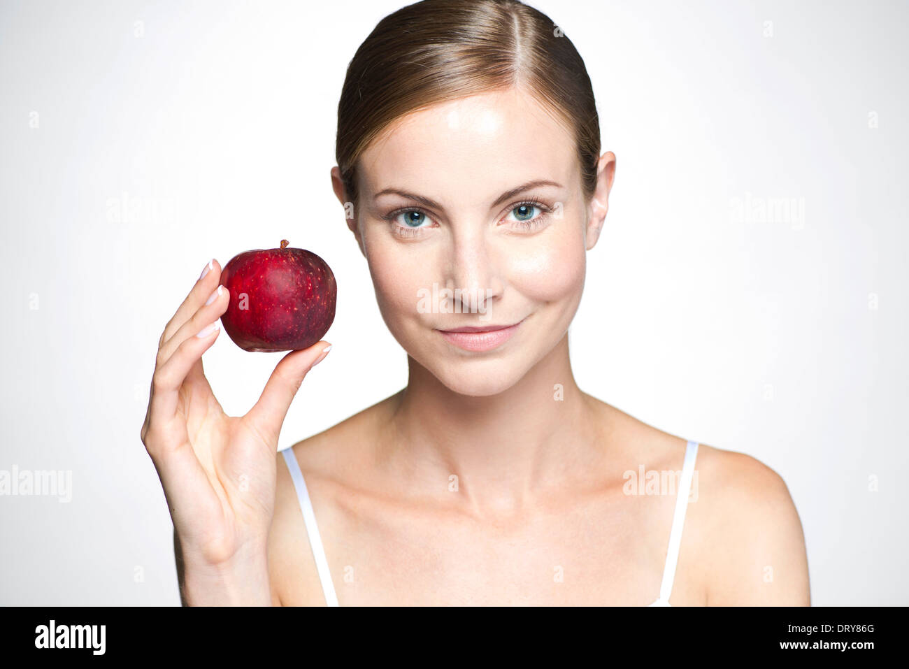 Young woman with apple Stock Photo - Alamy