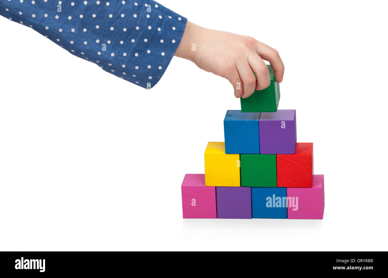 Child's hand building a brick tower isolated on white background Stock ...
