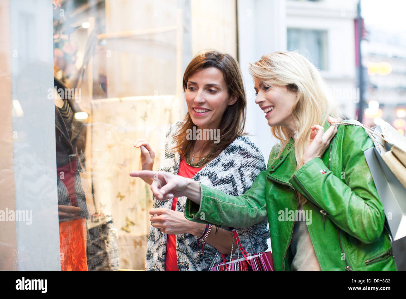 Women window shopping together Stock Photo - Alamy