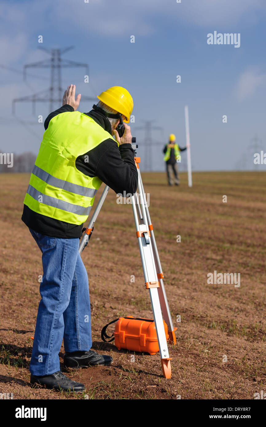 Geodesist measure land speak transmitter Stock Photo - Alamy