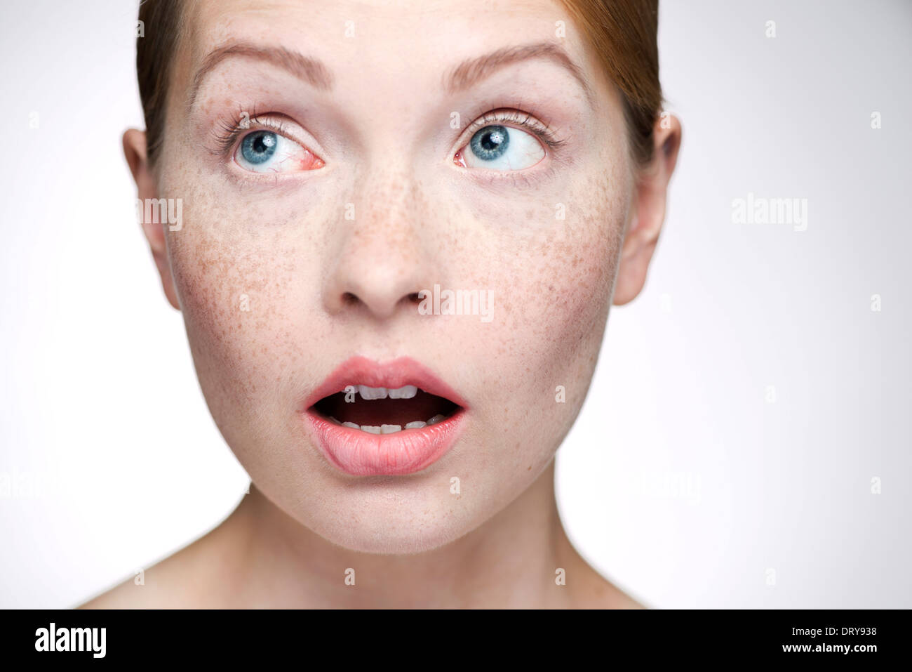 Young woman with look of surprise Stock Photo - Alamy