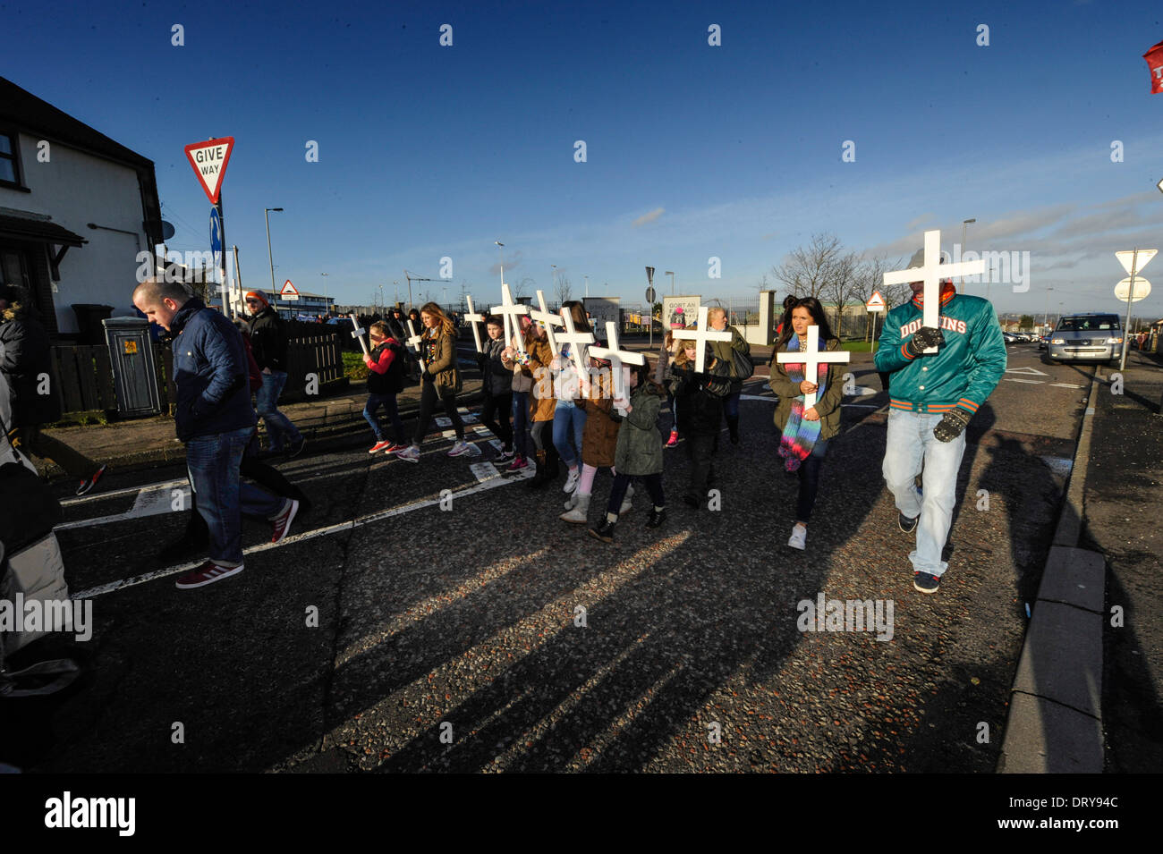 People carry crosses as thousands participate in the Bloody Sunday ...
