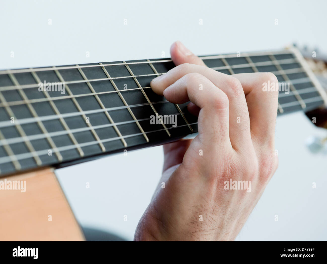 Musician playing acoustic guitar, close-up Stock Photo - Alamy