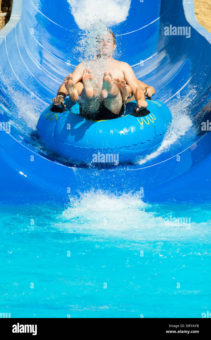 People having fun, sliding at water park Stock Photo - Alamy