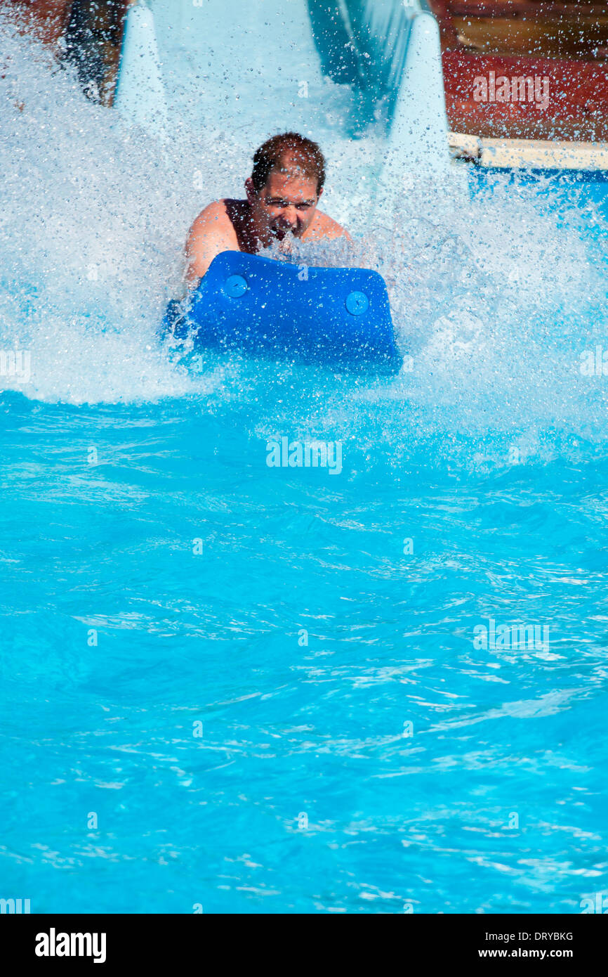 Man water sliding aqua park hi-res stock photography and images - Alamy