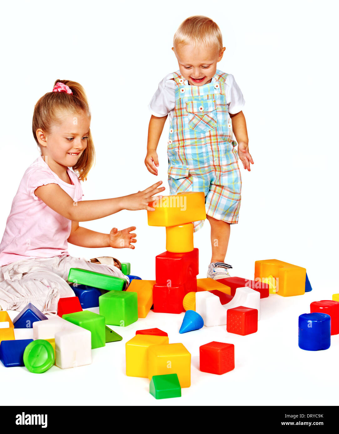 Happy children playing building blocks Stock Photo - Alamy