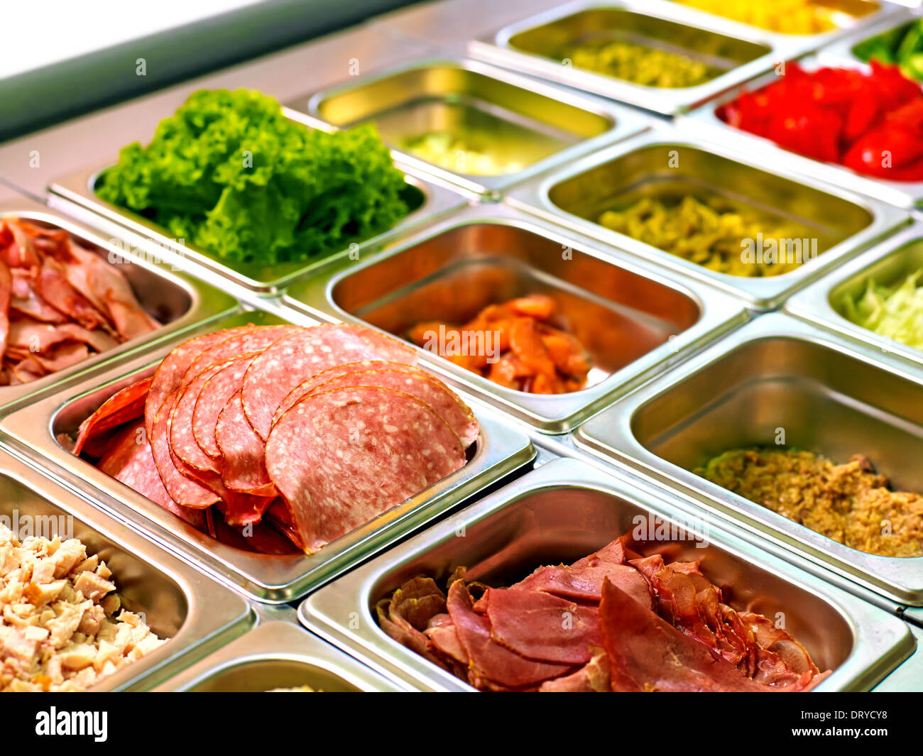 Tray with cooked food on showcase at cafeteria Stock Photo - Alamy