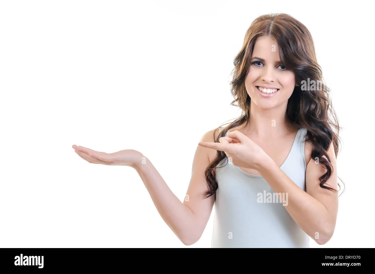 portrait of young beautiful brunette woman posing with empty hand palm ...