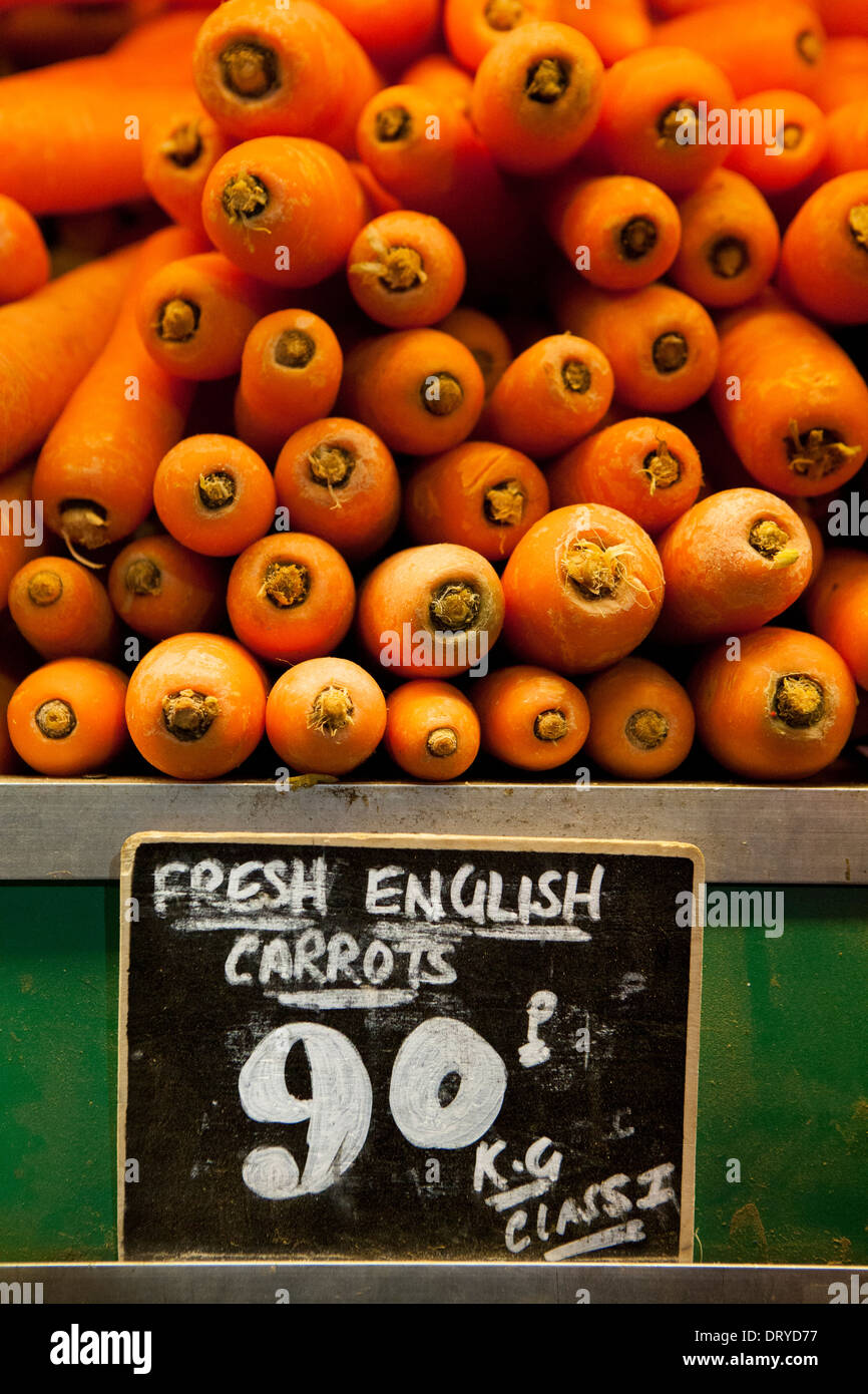 Market stall display of carrots with chalk board sign Stock Photo - Alamy