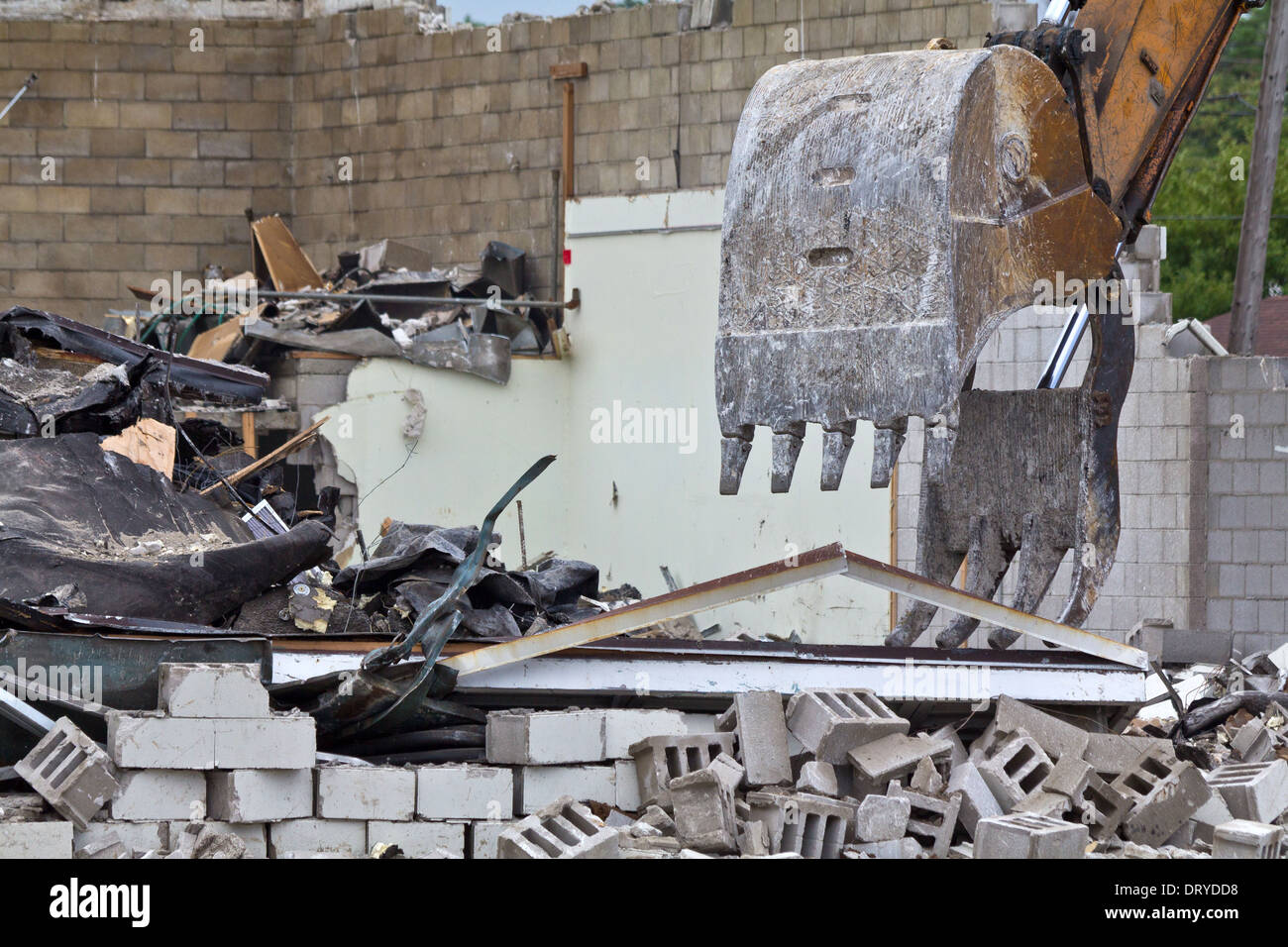 Excavator driver working on construction site digger demolishing ...
