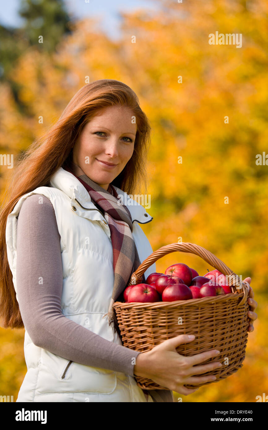 Autumn country - woman with wicker basket Stock Photo - Alamy