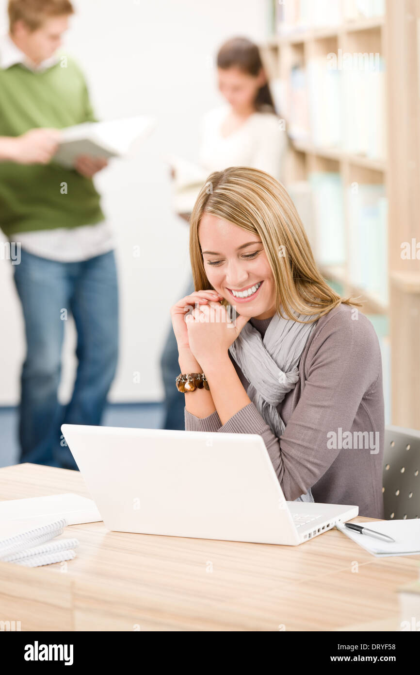 High school library - student with laptop Stock Photo - Alamy