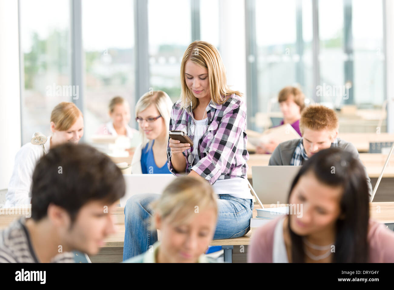 High school student - woman with mp3 player Stock Photo - Alamy