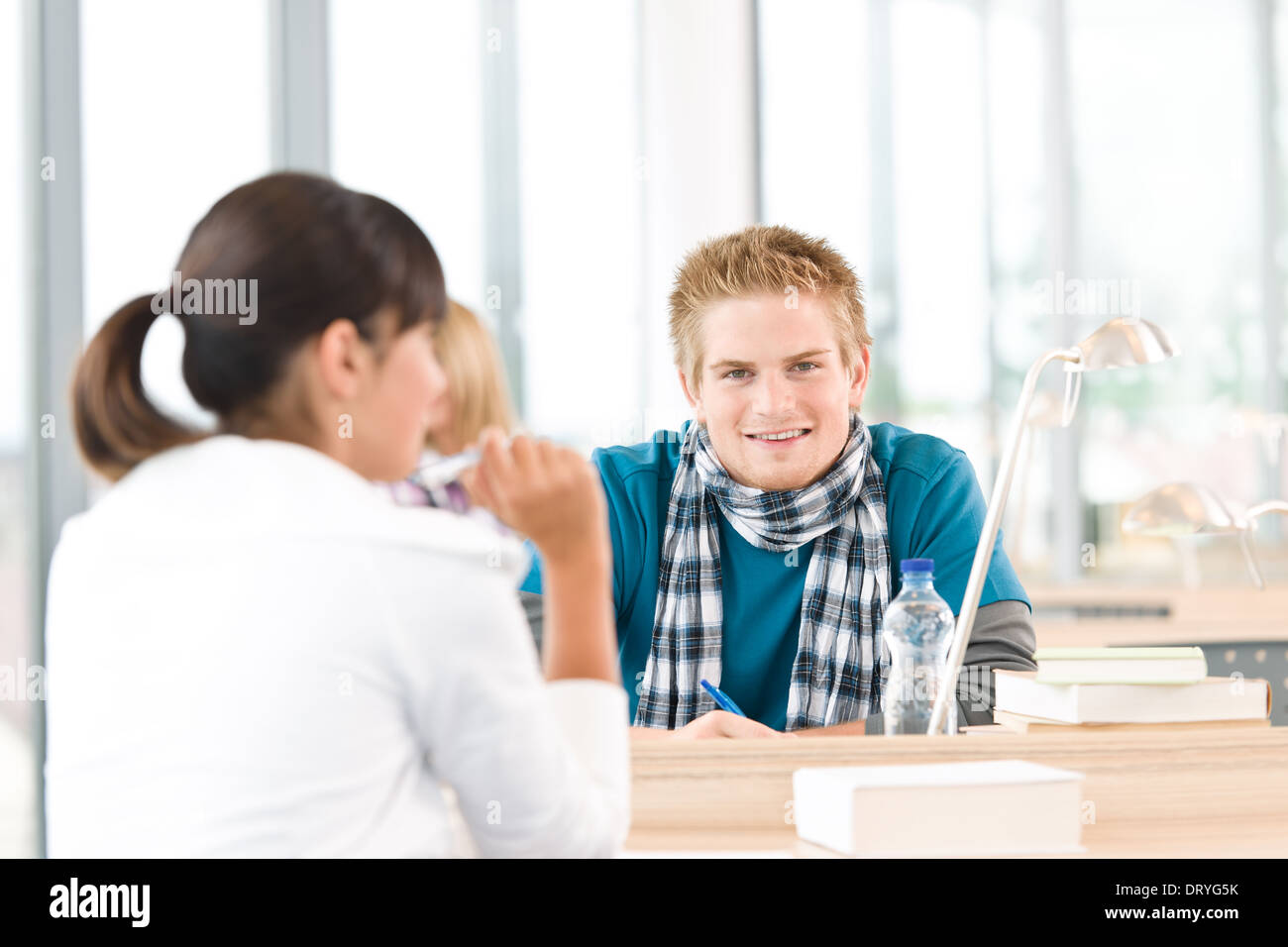 Three high school students in classroom Stock Photo - Alamy
