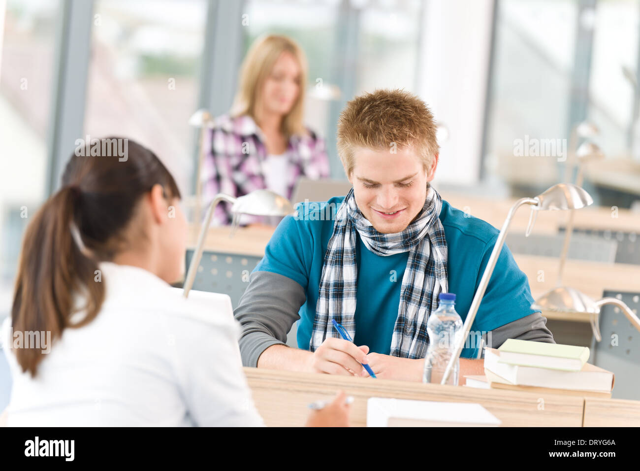 Three high school students in classroom Stock Photo - Alamy