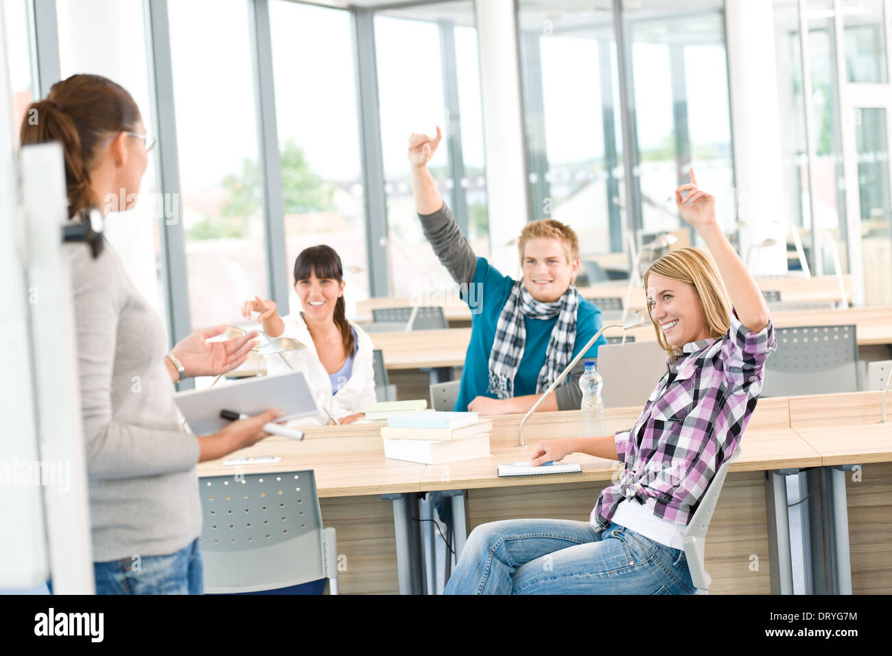High school students raising hands Stock Photo - Alamy