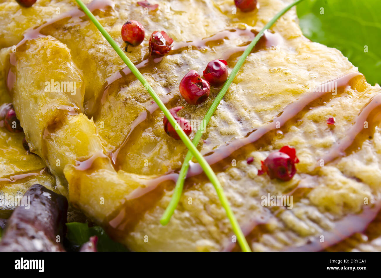 roasted one fish with balsamico cream ones Stock Photo - Alamy