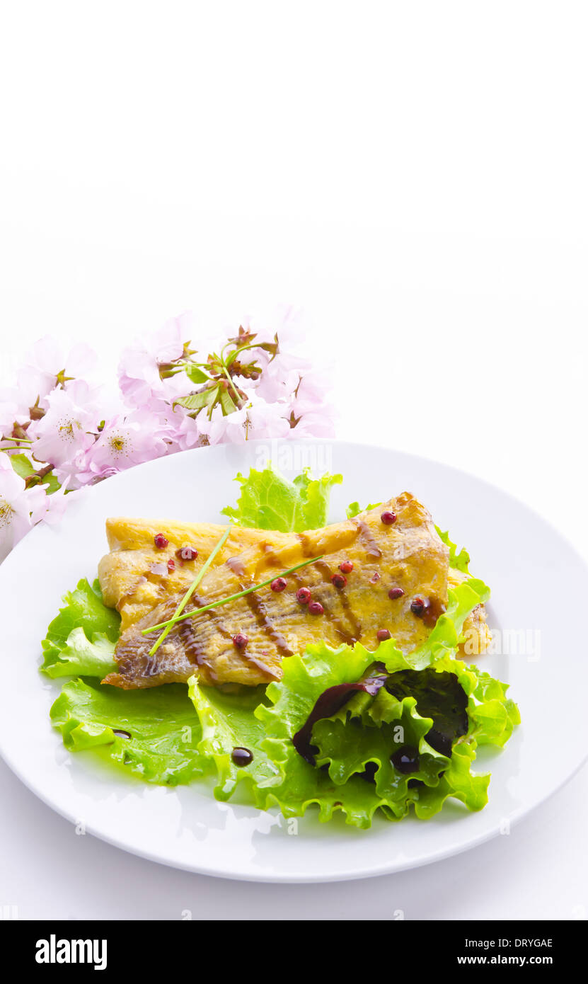 roasted one fish with balsamico cream ones Stock Photo - Alamy