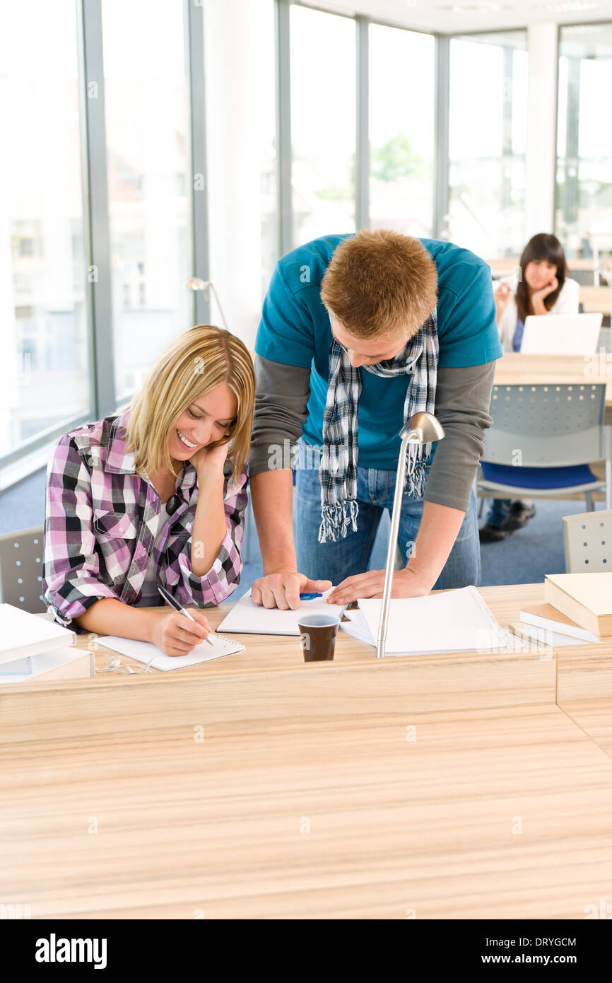 Two students at high school writing notes Stock Photo - Alamy