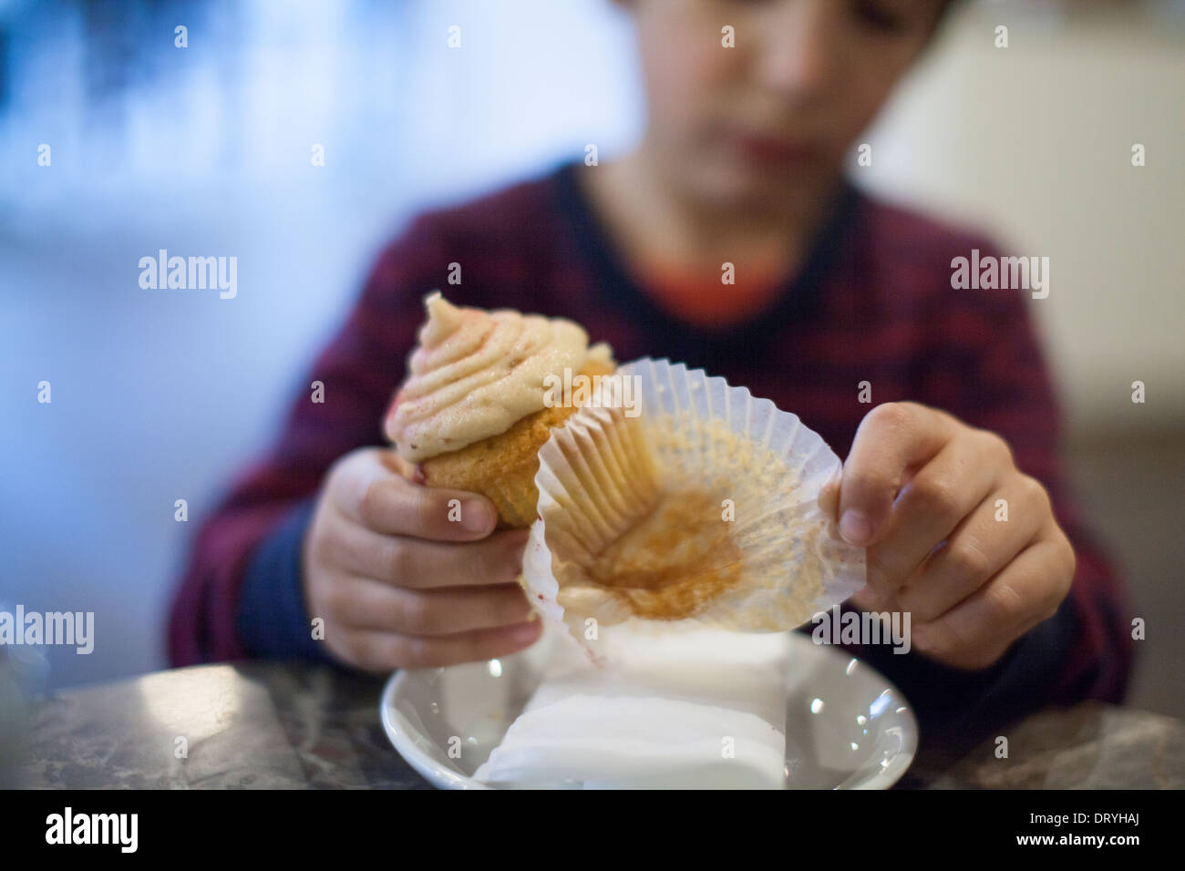 Child eating cupcake Stock Photo - Alamy