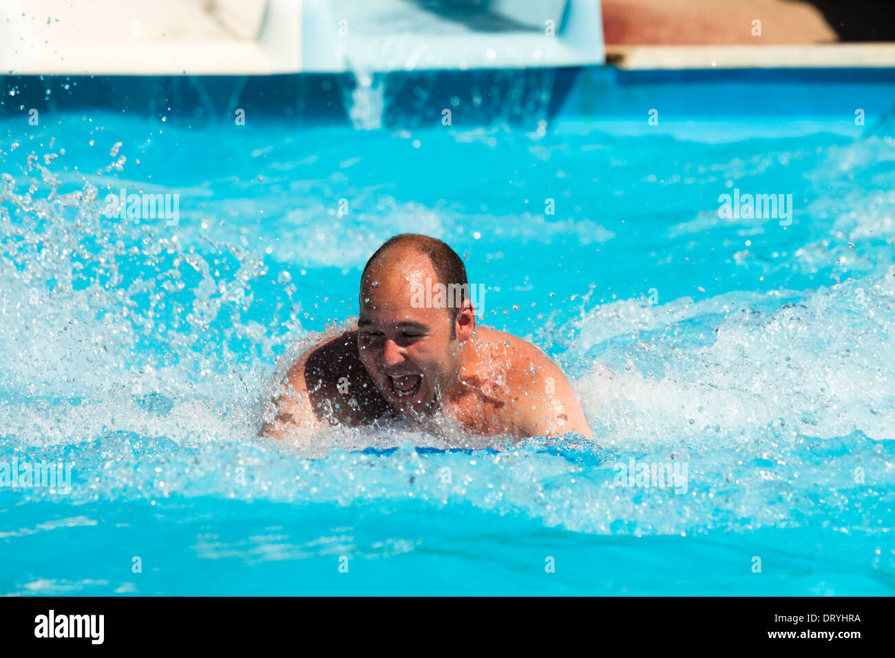 Man water sliding aqua park hi-res stock photography and images - Alamy