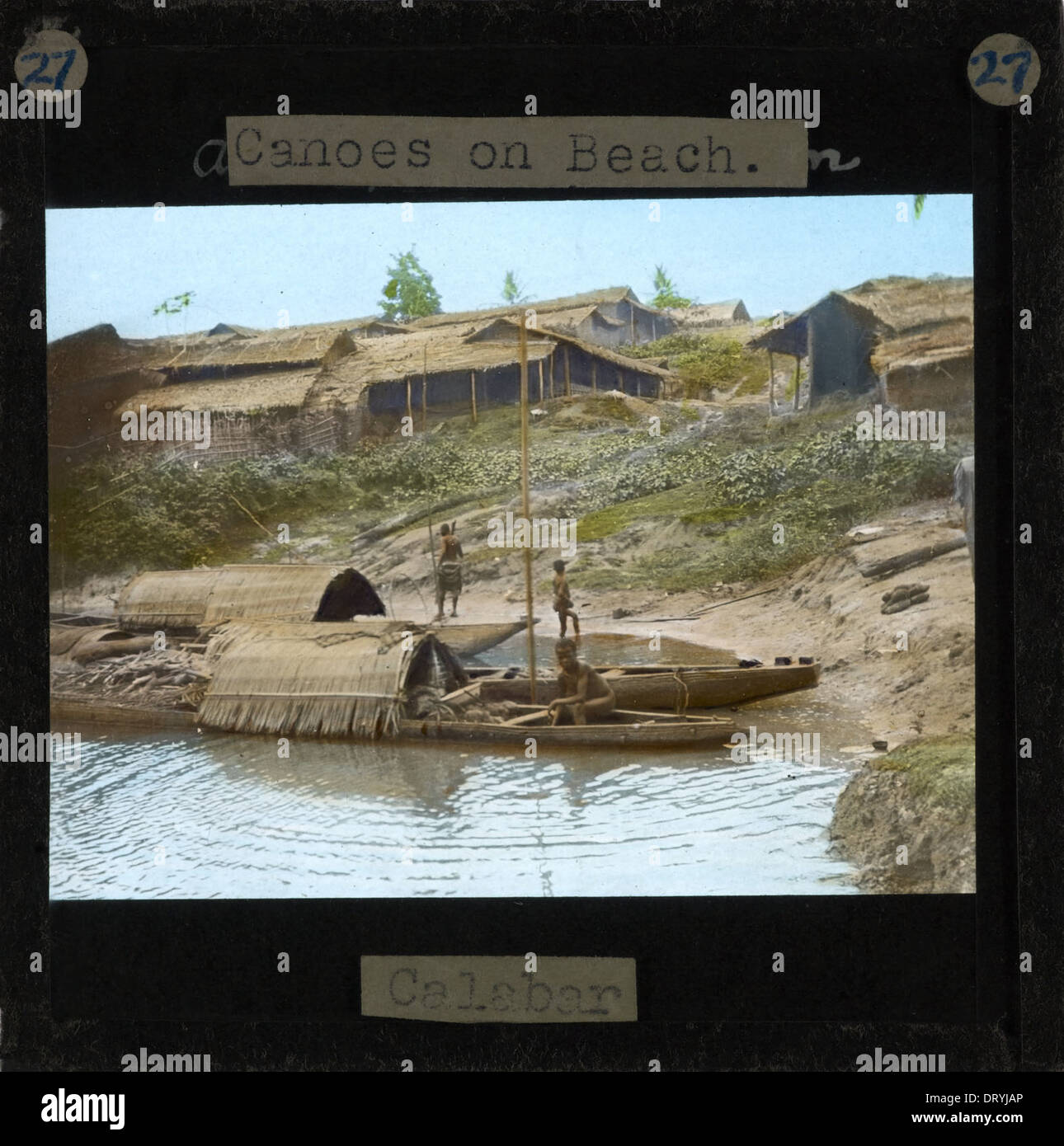 A photograph of canoes on the beach at Calabar, captured in the late ...