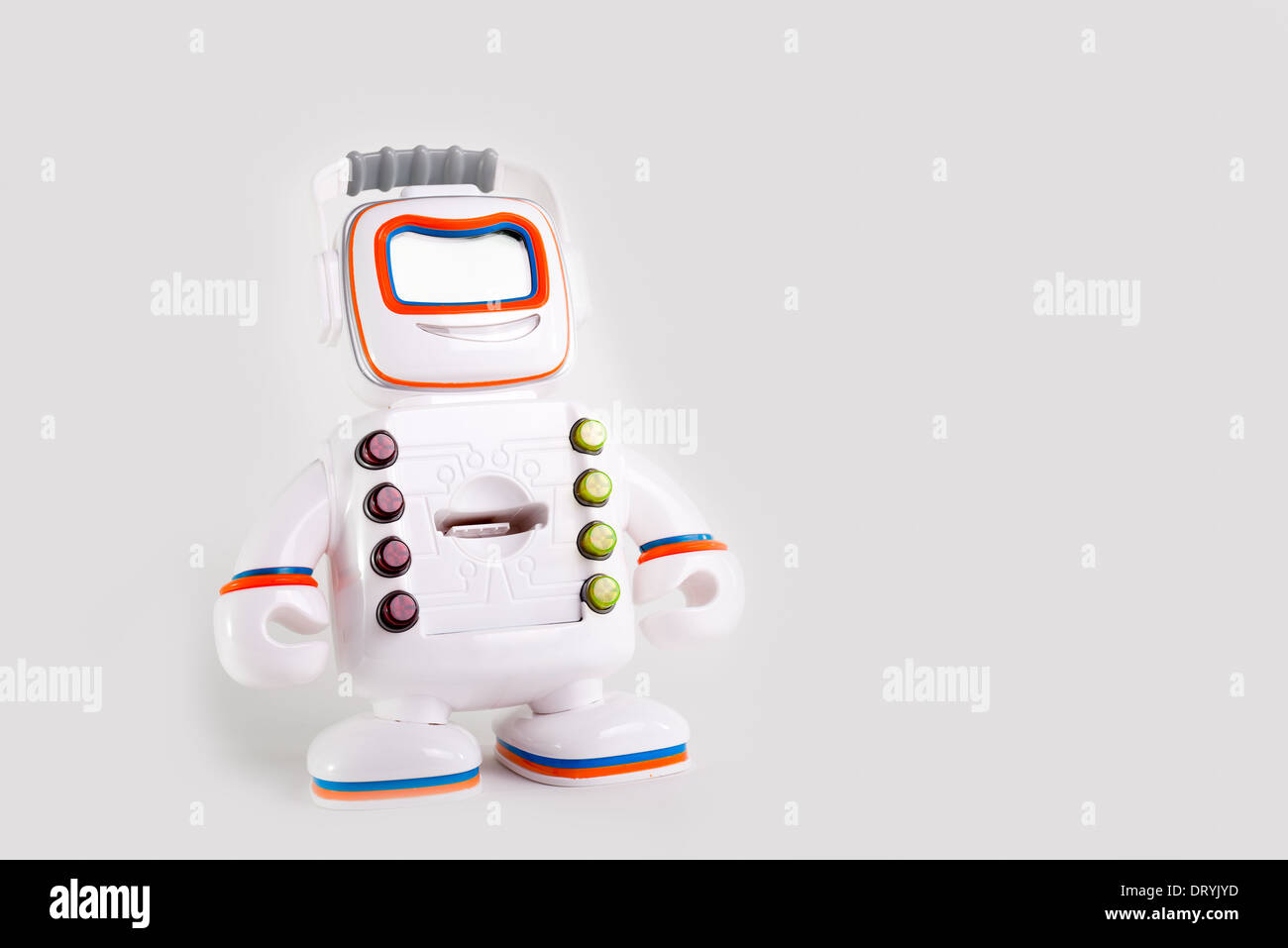 White toy robot on a white background Stock Photo - Alamy