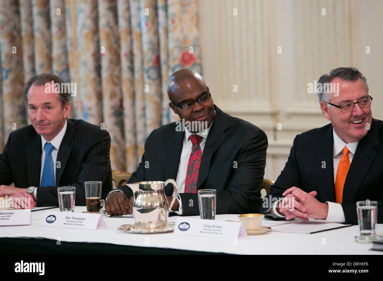 Don Thompson, President and CEO of McDonalds, center, attends a meeting ...