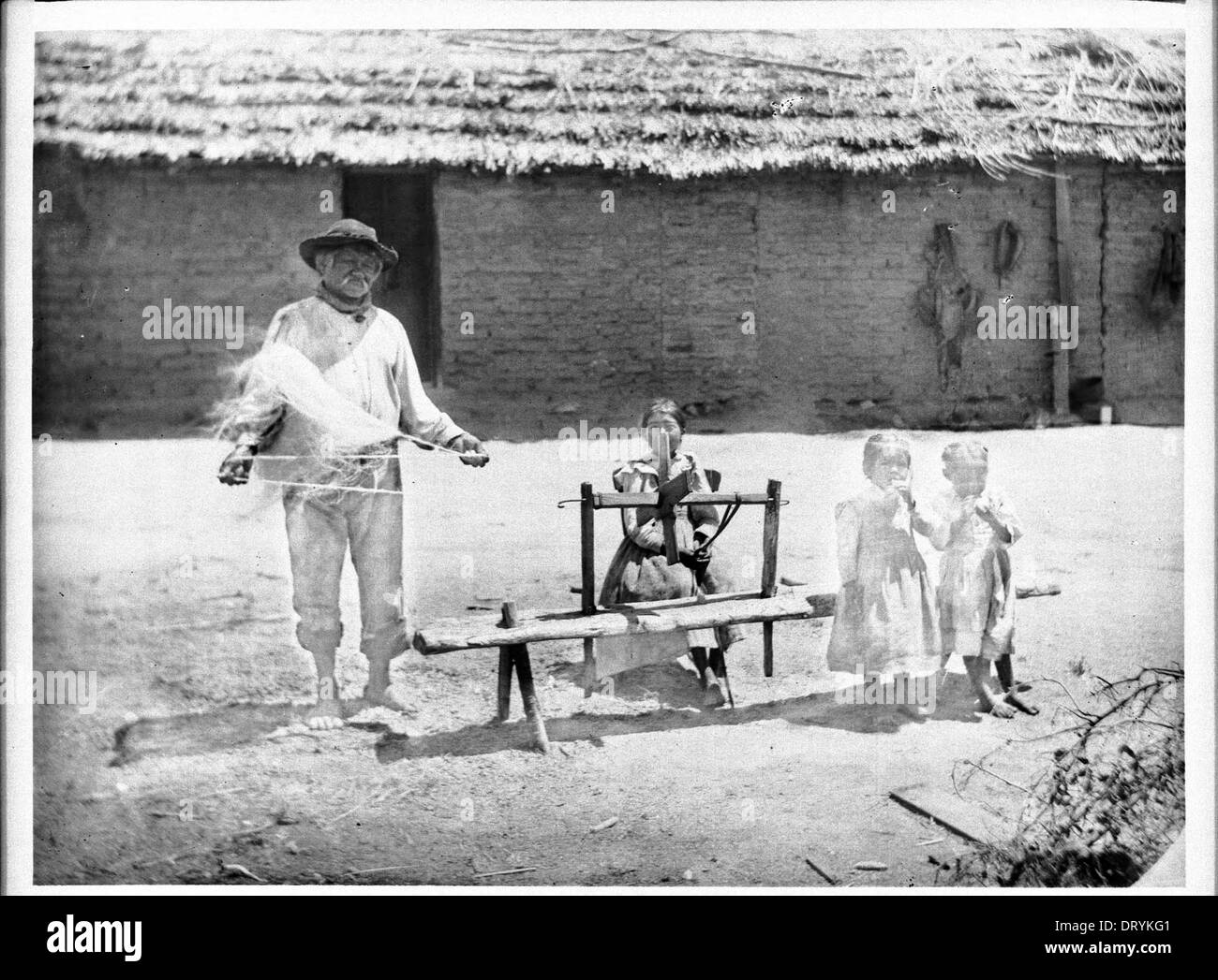 Agua Caliente Indian man, Simon Cibinoat, spinning Yucca fiber into ...