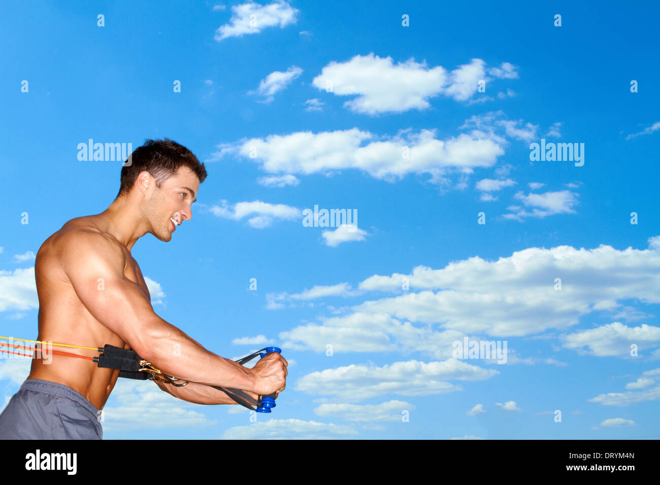 Exercising over sky background Stock Photo - Alamy