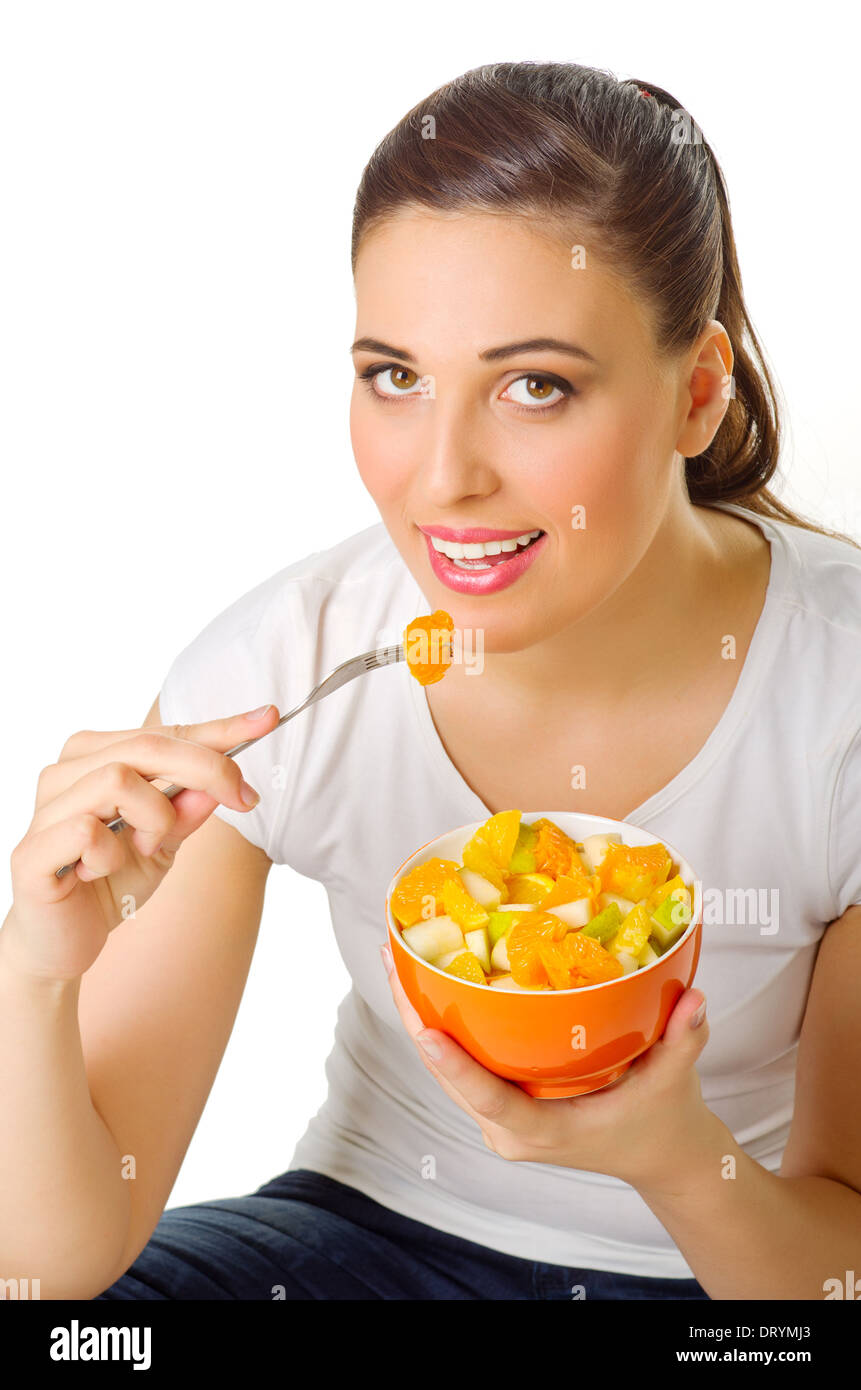 Young girl eat fruits isolated Stock Photo - Alamy