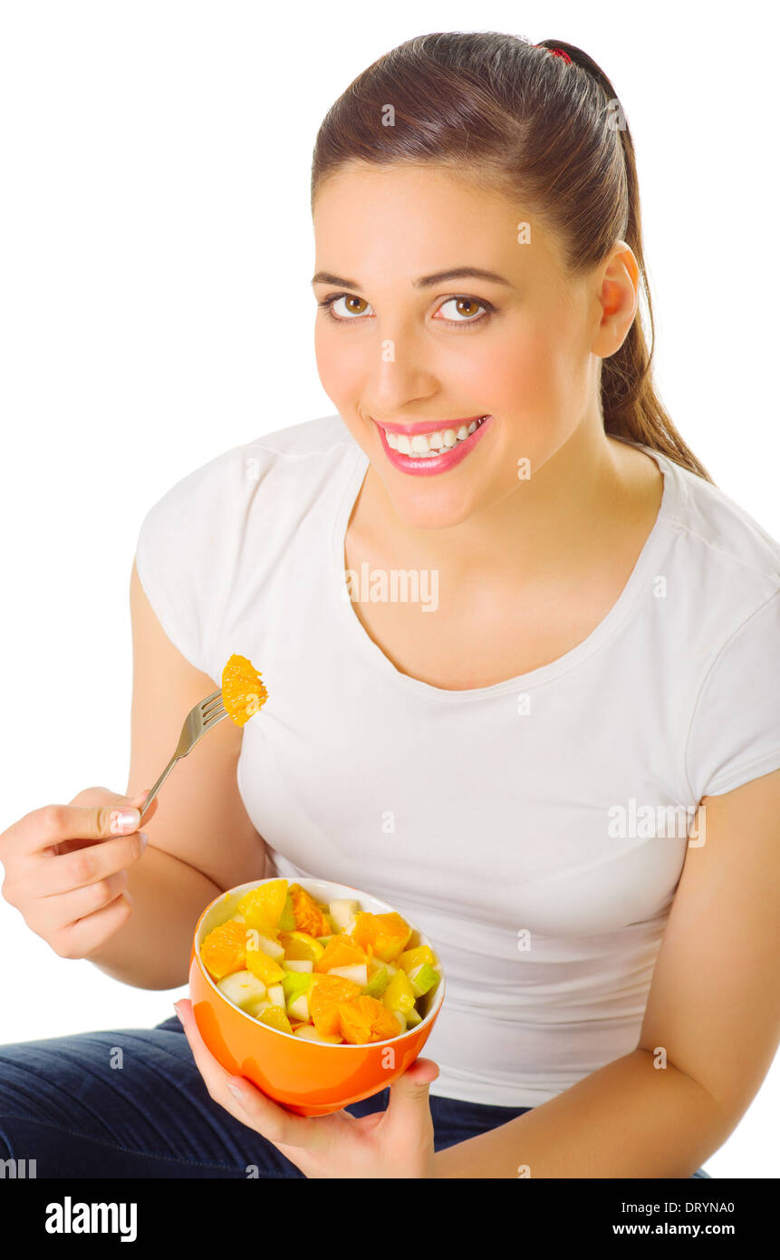 Young girl eat fruit salad isolated Stock Photo - Alamy