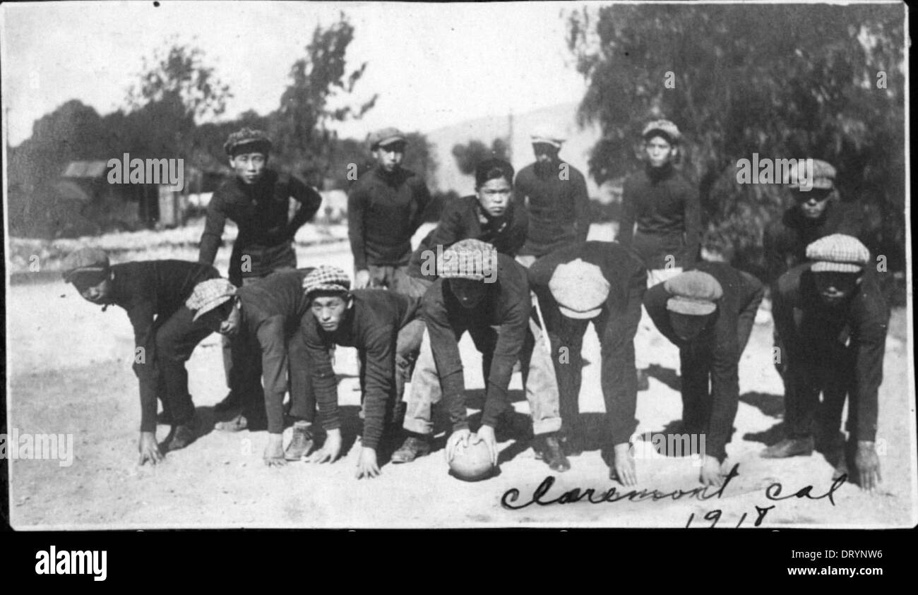 A group of 13 football players captured in a historical photograph ...