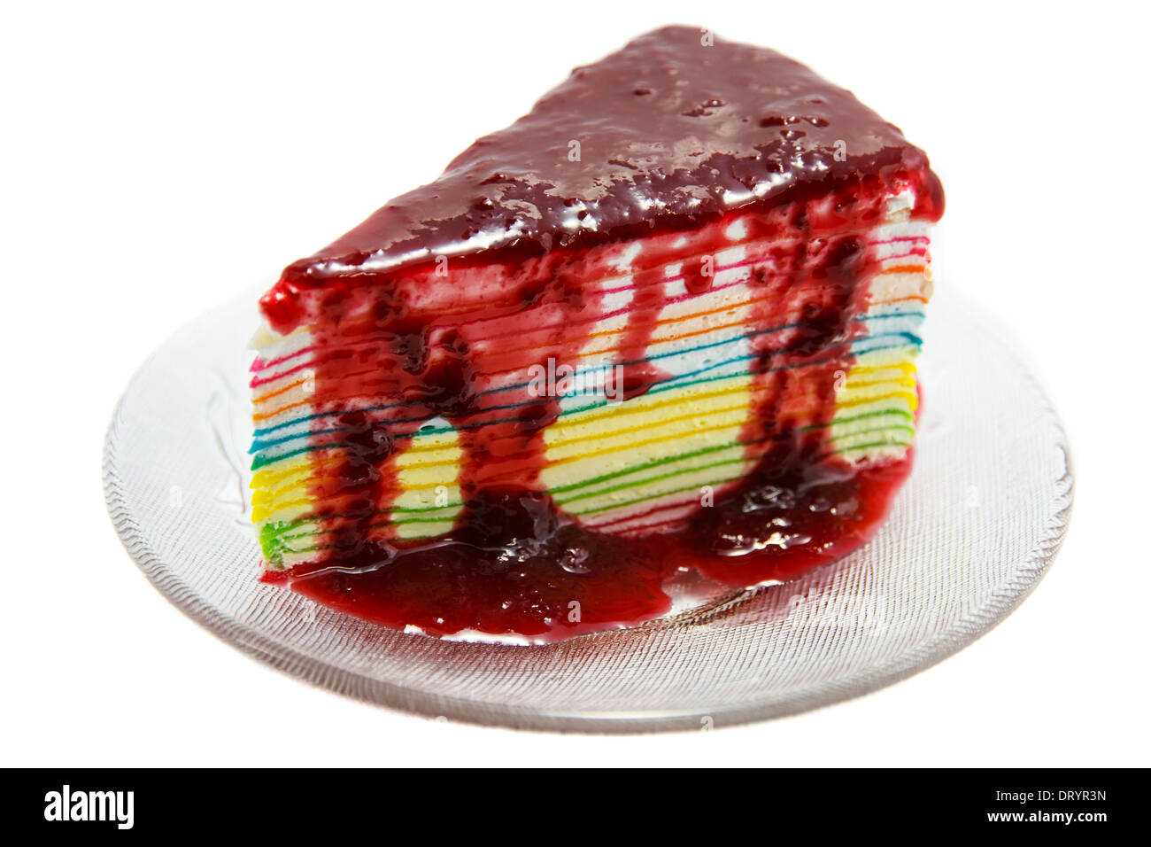 Fancy cake topped with a berry on white background Stock Photo - Alamy