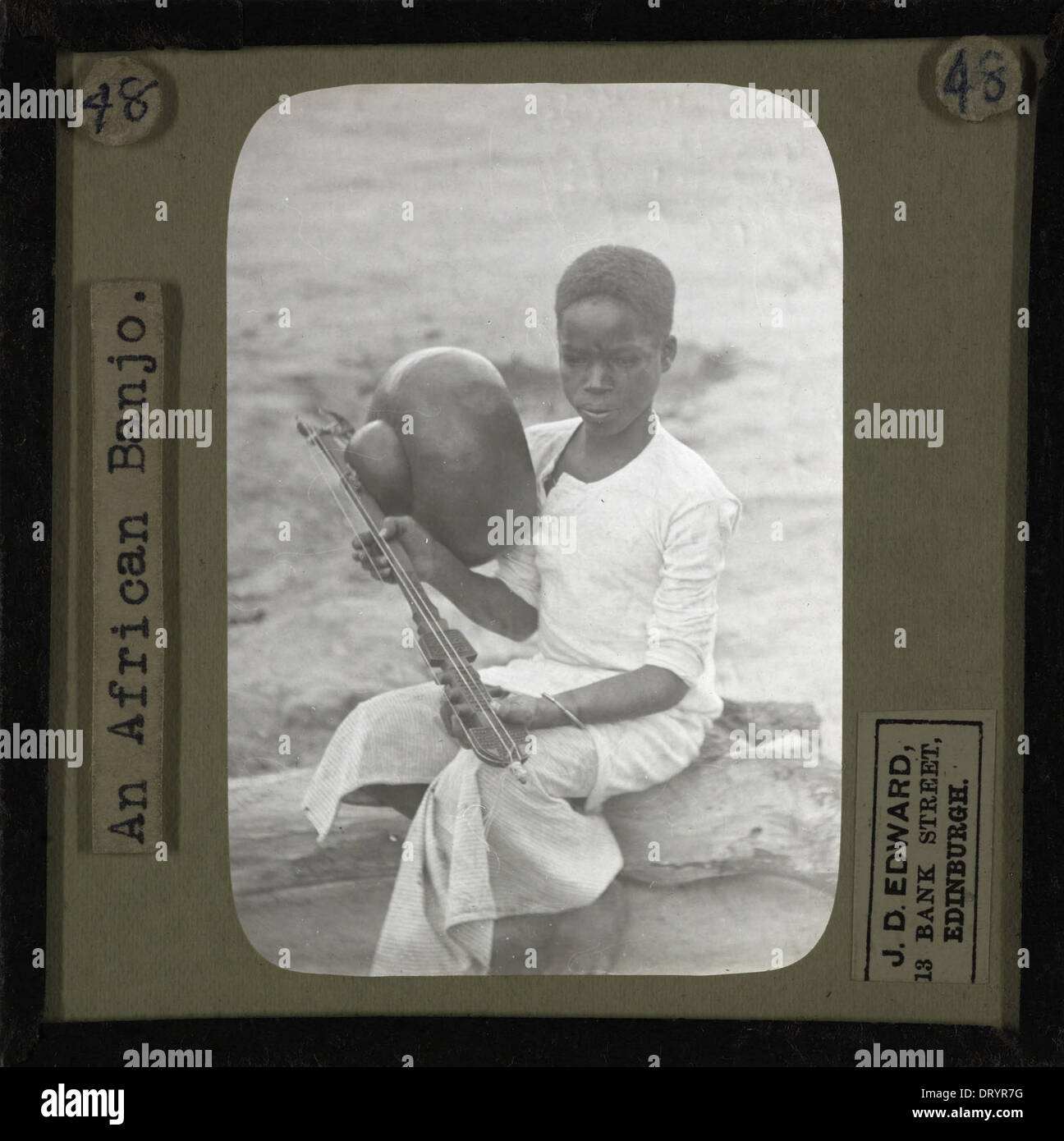 An African banjo from Zambia, photographed between 1905 and 1940. The ...