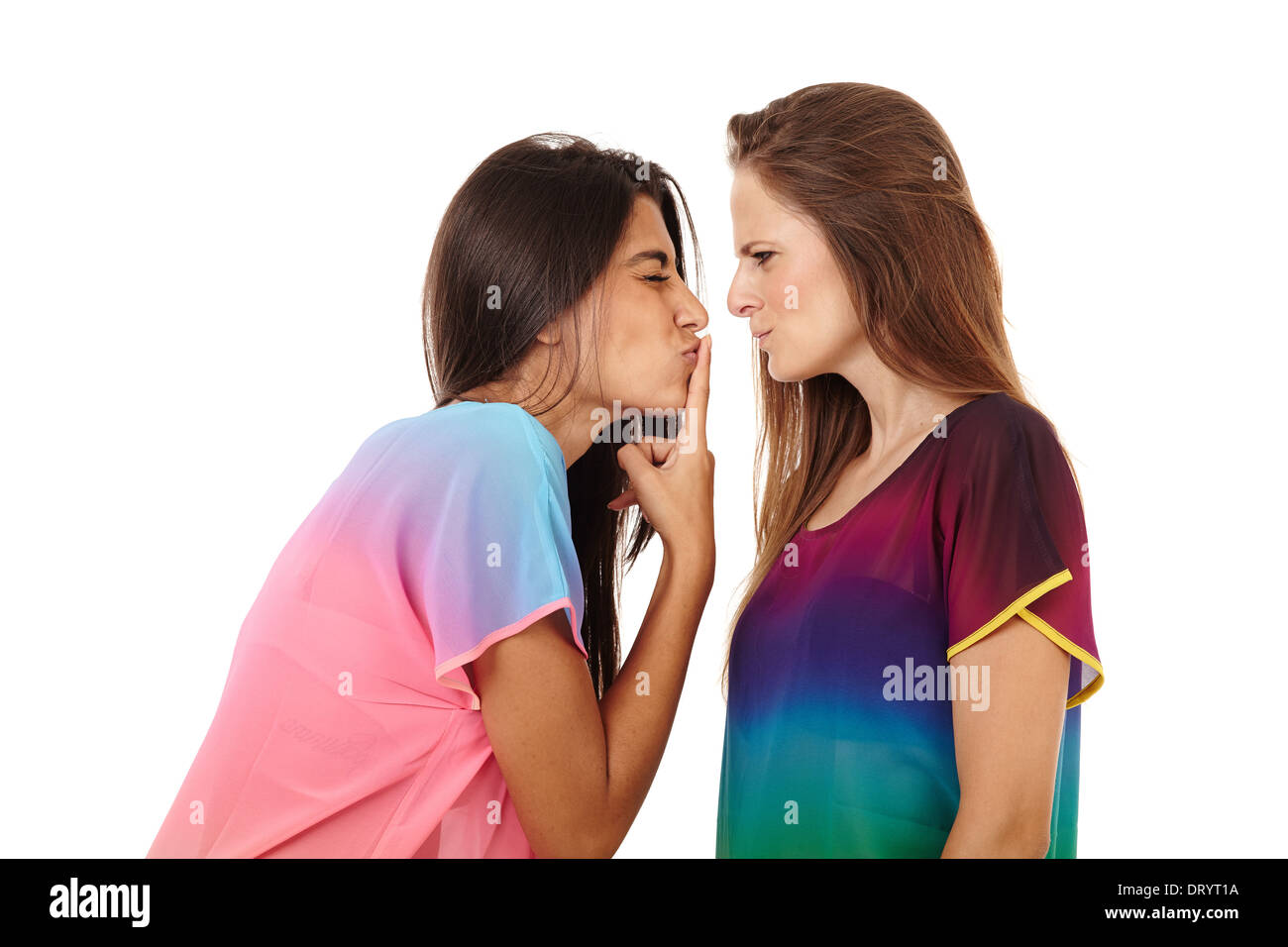 Portrait of two girlfriends playing and having fun isolated on white ...