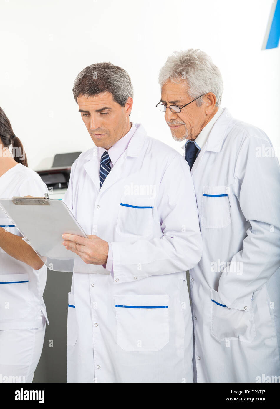 Researchers Reading Clipboard Stock Photo - Alamy