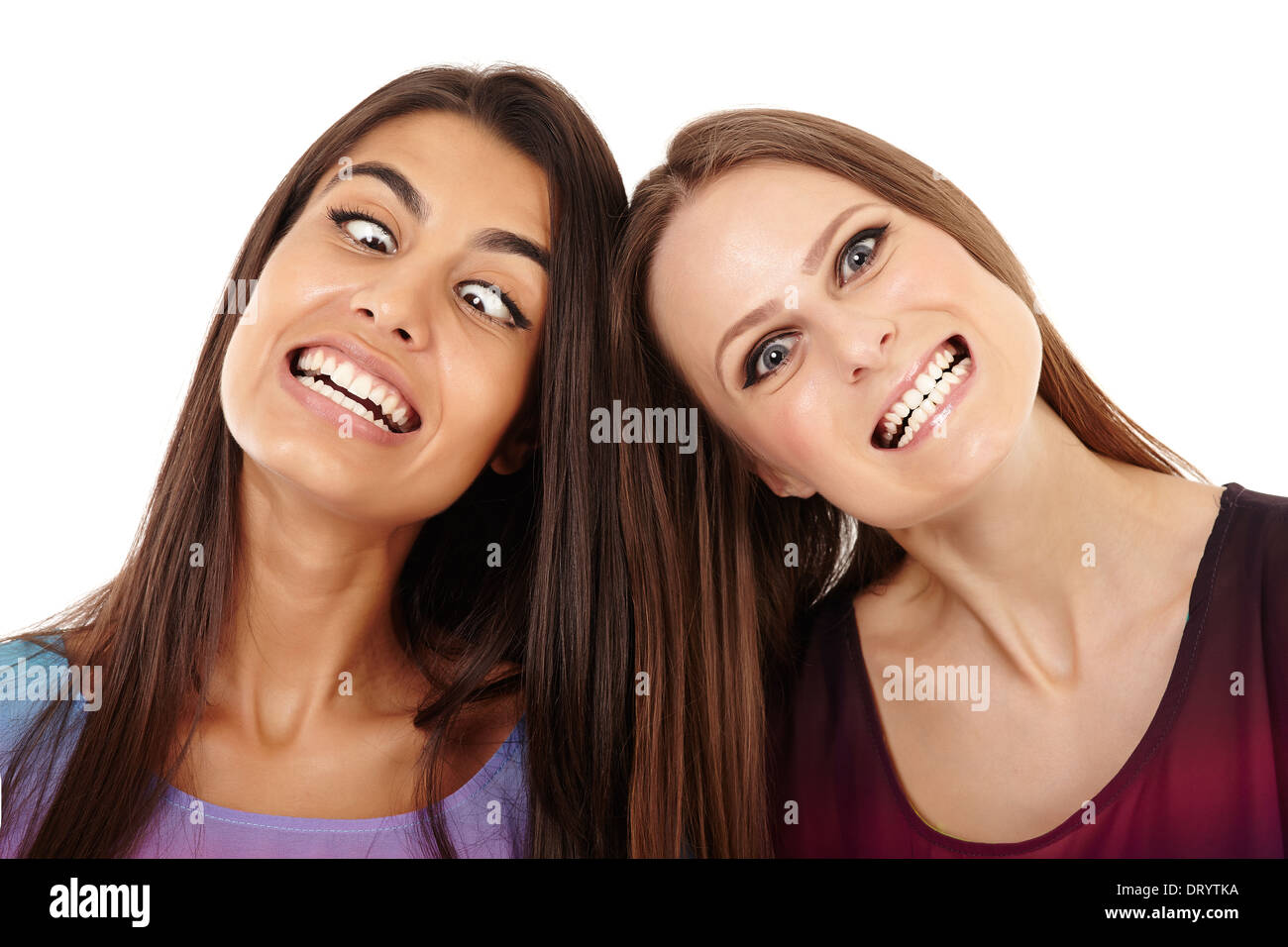 Closeup of two girlfriends making funny faces isolated on white Stock ...