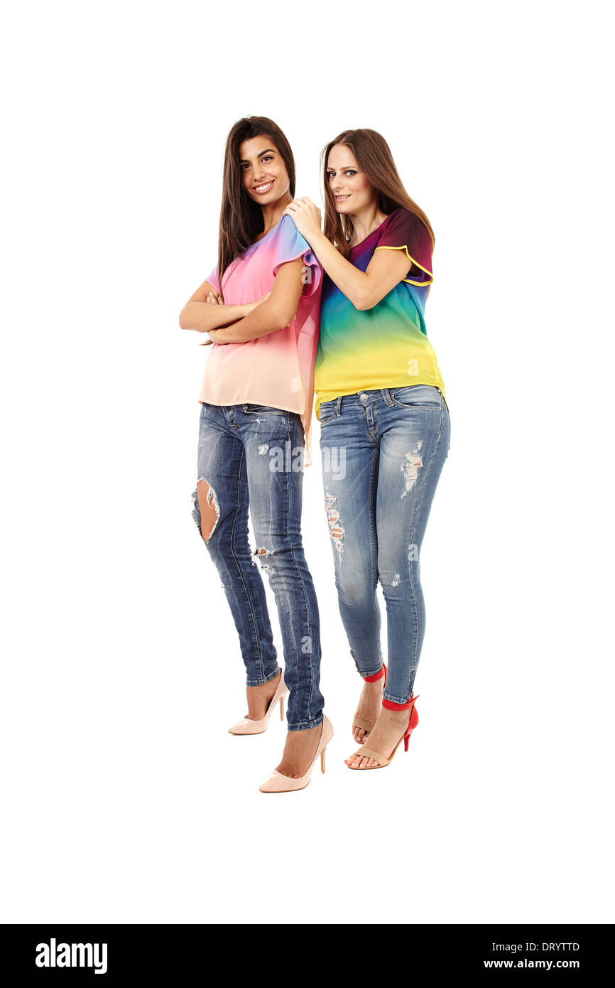 Portrait of two girlfriends playing and having fun isolated on white ...