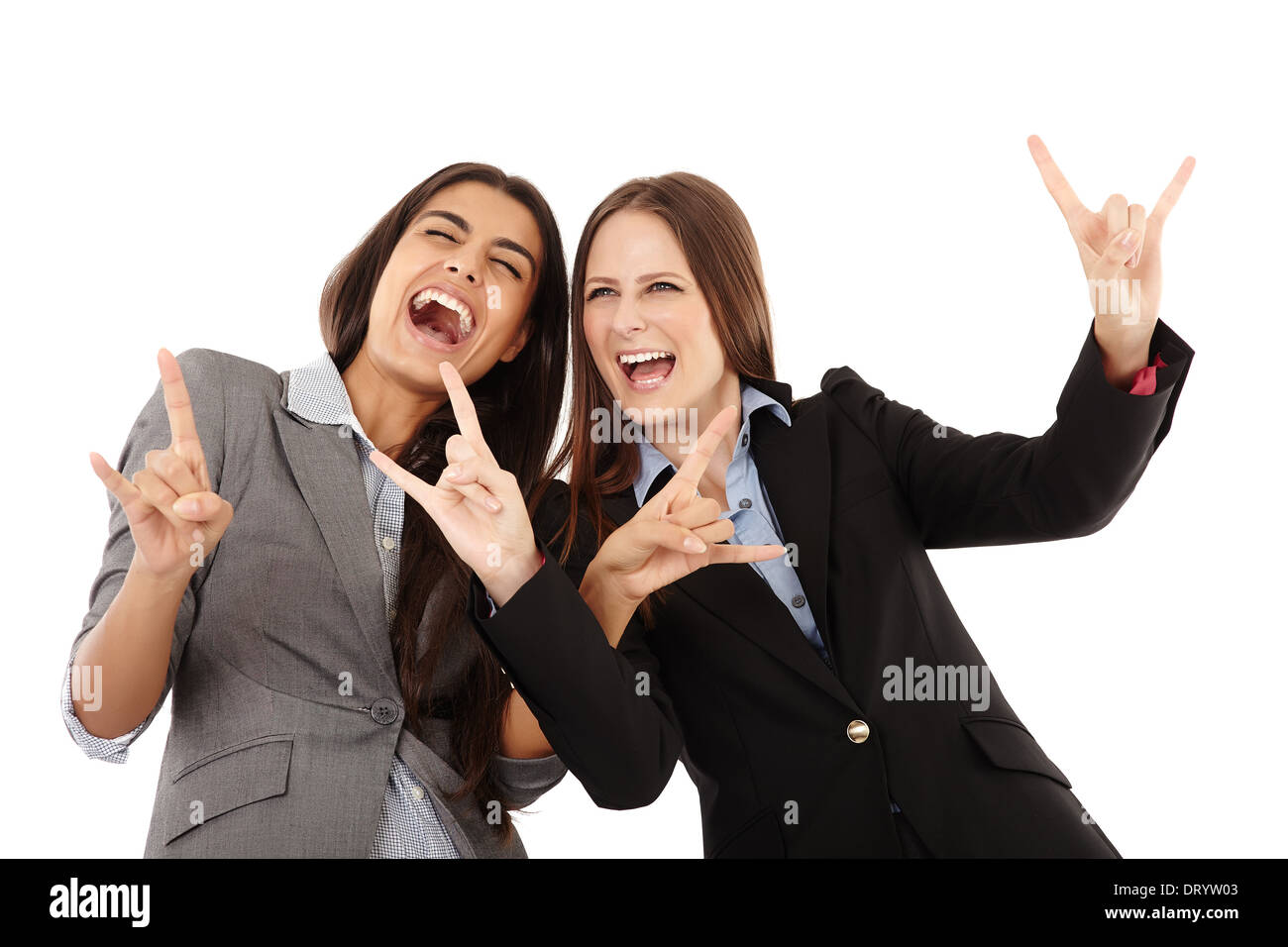 Portrait of businesswomen making a rock and roll hand gesture over ...