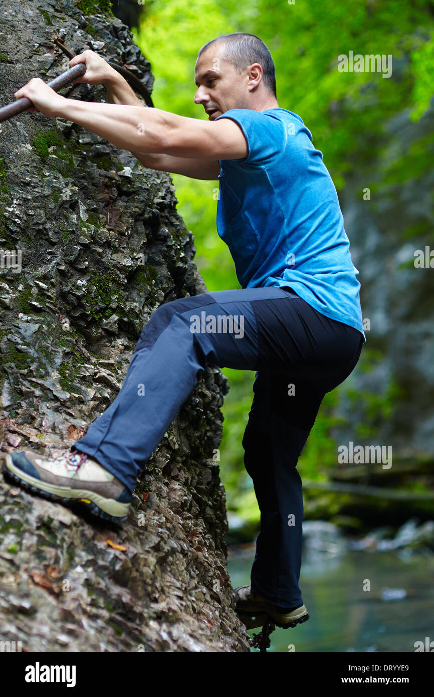 Man climbing over wall hi-res stock photography and images - Alamy