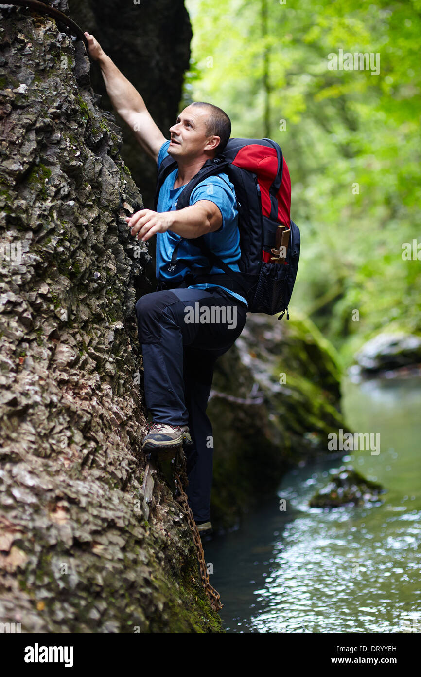 Man climbing over wall hi-res stock photography and images - Alamy
