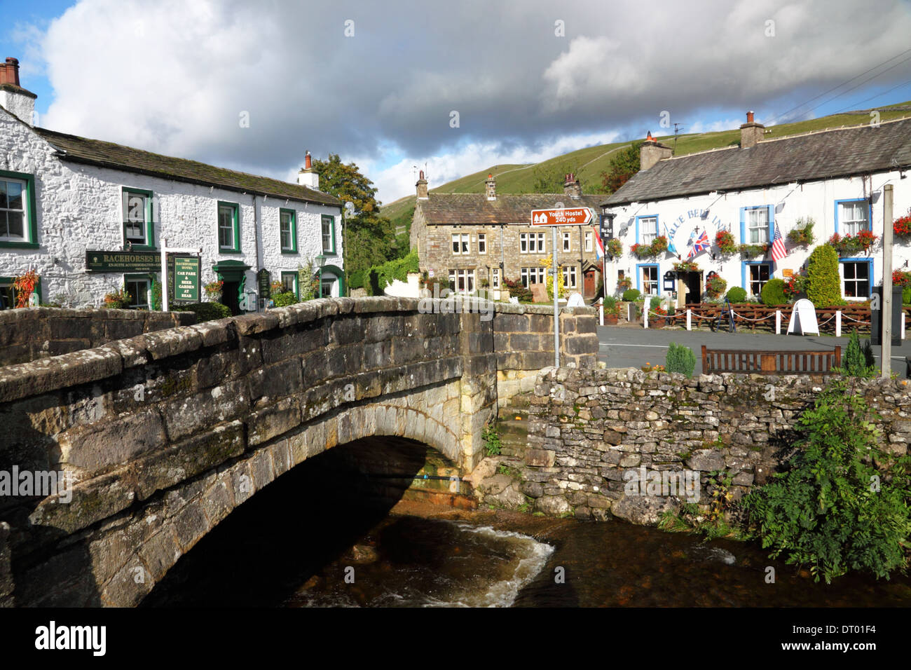 A village with whitewashed stone cottages, two 'pubs (The "Racehorses ...