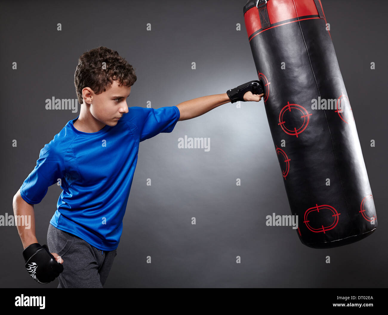 Boxing kid boy punching bag hi-res stock photography and images - Alamy